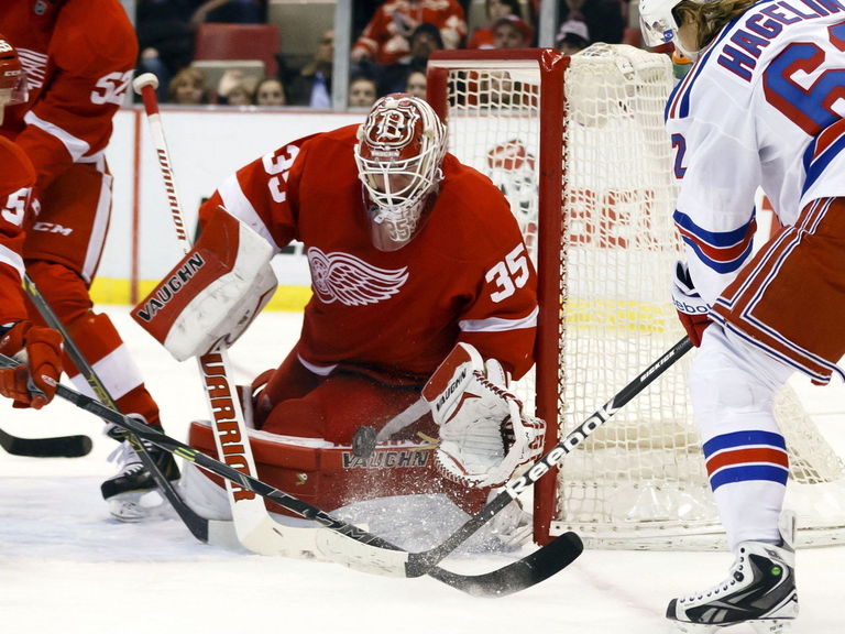 VIDEO: Red Wings' Howard spins around to swat wild puck away from ...