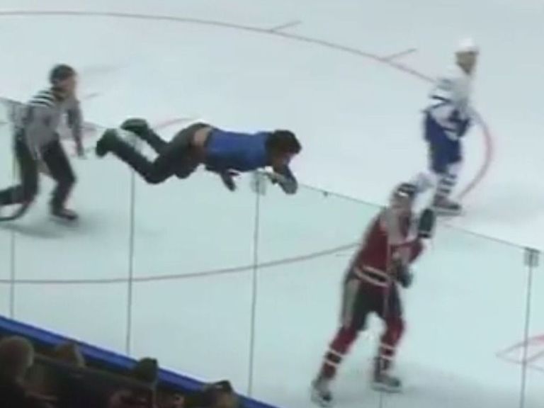 Watch: Fan climbs glass, runs on ice at OHL game | theScore.com