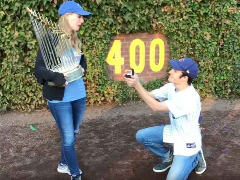 Cubs fan proposes to girlfriend while she holds World Series trophy ...
