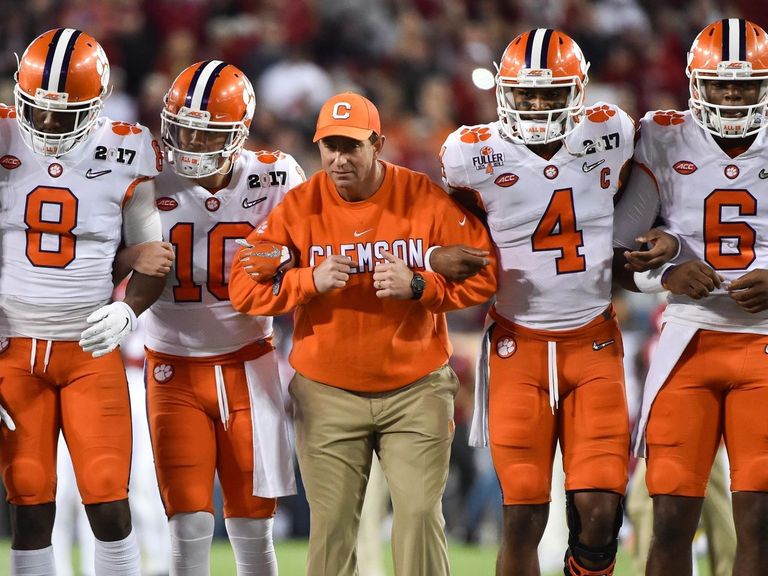 Watch: Clemson takes field as a team with linked arms | theScore.com