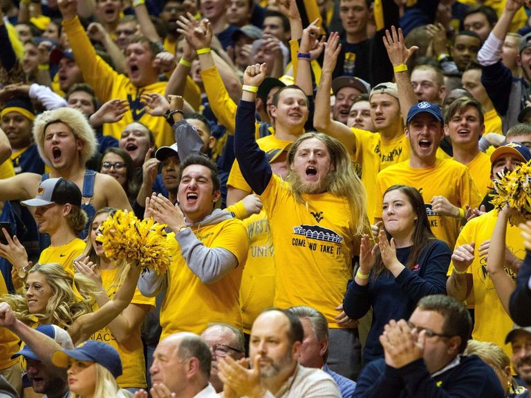 Watch: West Virginia fans storm court despite being 6-point favorites ...