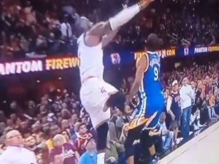 Watch: LeBron's leg kick catches Iguodala between the legs | theScore.com