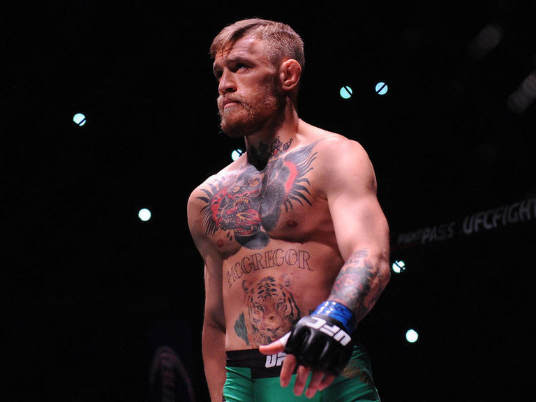 Watch: McGregor jumps cage, confronts referee, slaps official at ...