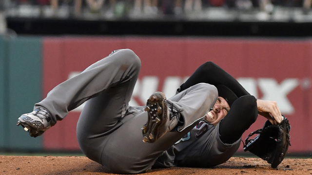 D-Backs' Ray carted off field after taking line drive to he…