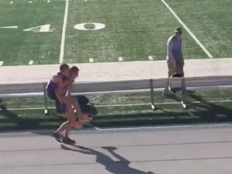 Watch: High schooler carries injured teammate to finish line | theScore.com