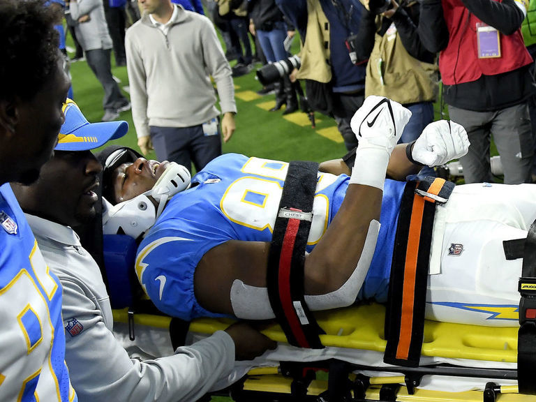 Chargers' Parham taken off on stretcher after hitting head on ground ...